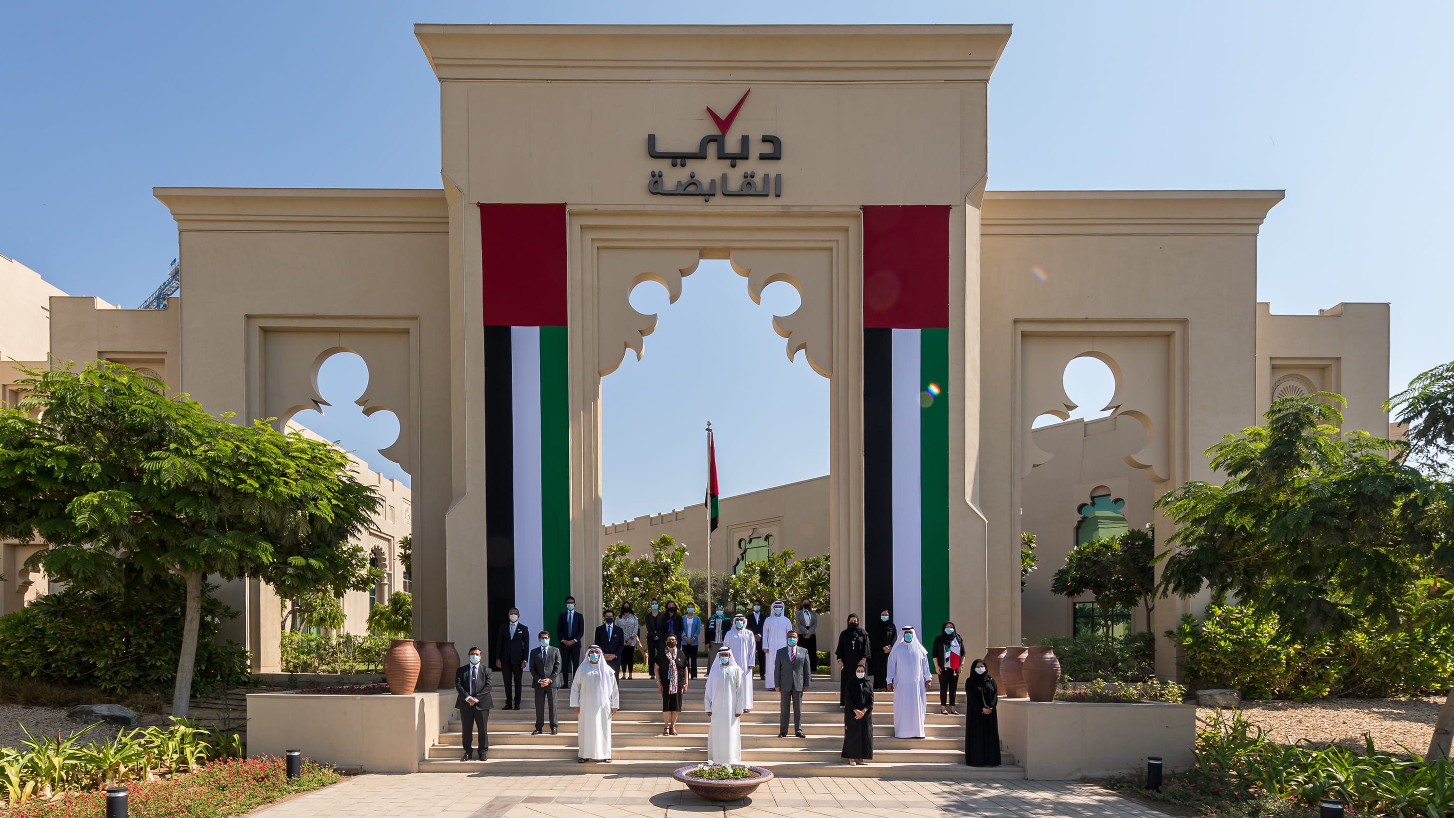 Dubai Holding employees gather for official flag-raising ceremony to ...