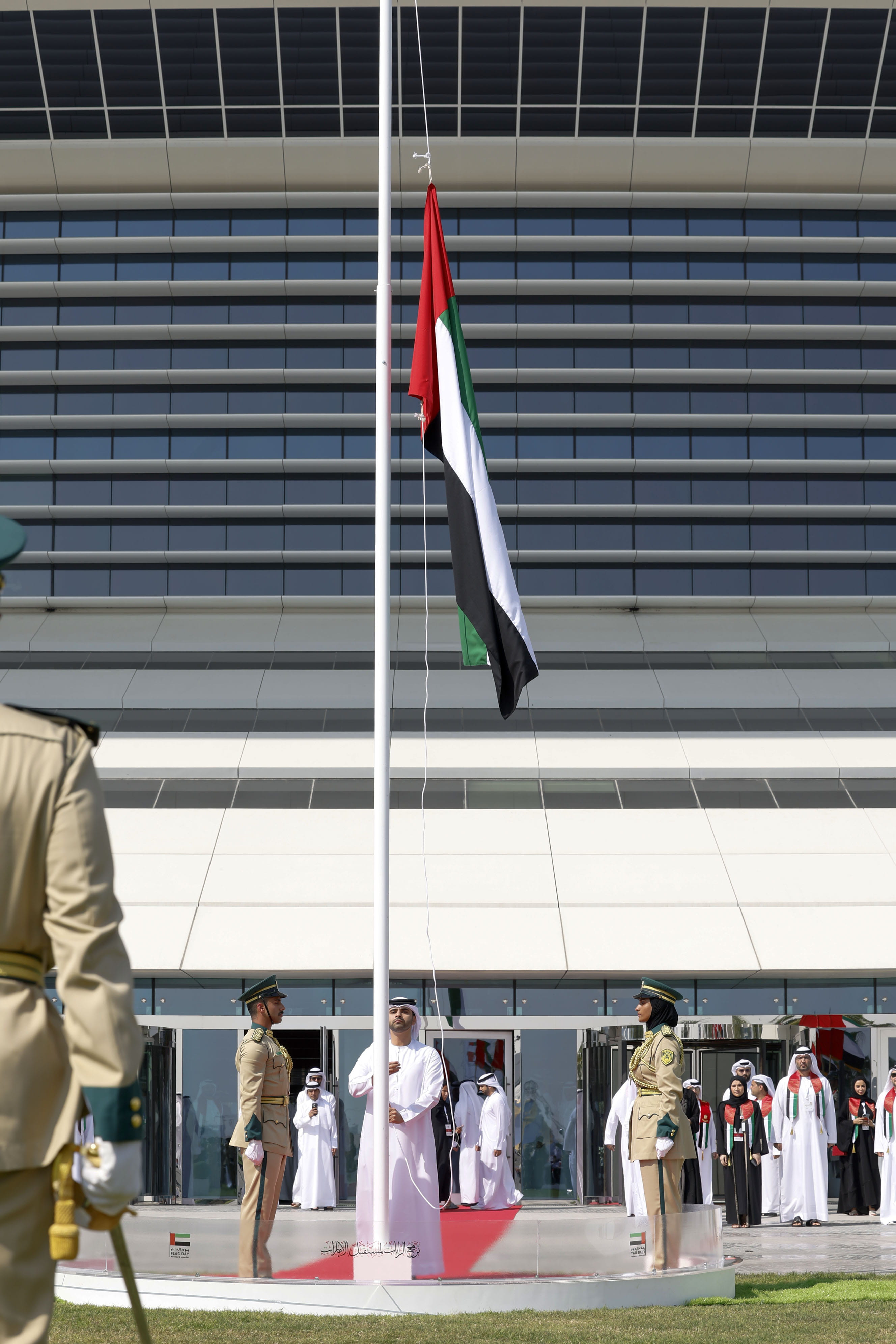 Mansoor bin Mohammed hoists the UAE flag at the Mohammed Bin Rashid Library
